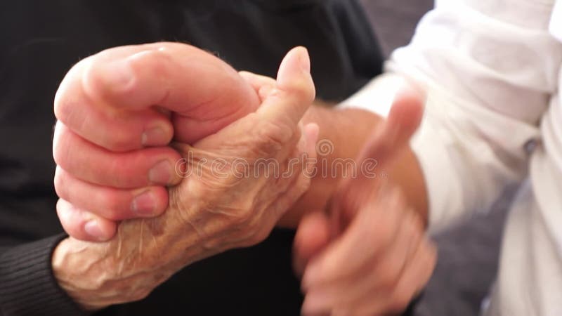 Close-up of Old and Young Hands Moving, Symbolising Support and ...