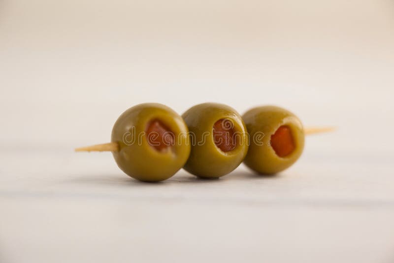 Close Up of Olives in Toothpick on Table Stock Photo - Image of empty ...