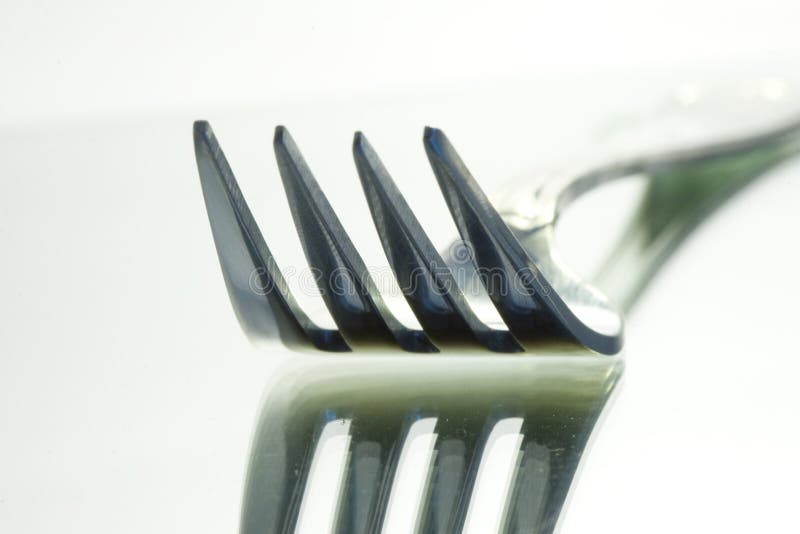 Close-up Of One Fork On A Mirror Stock Photo - Image of horizontal ...