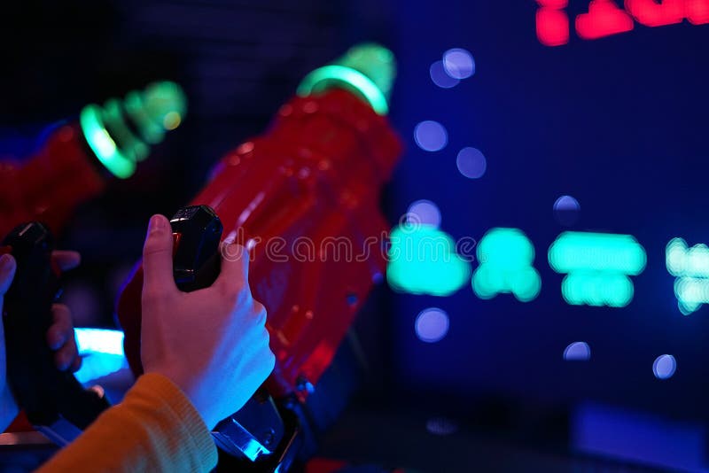 Close Up of One Hands Playing in a Game Machine in an Arcade ...