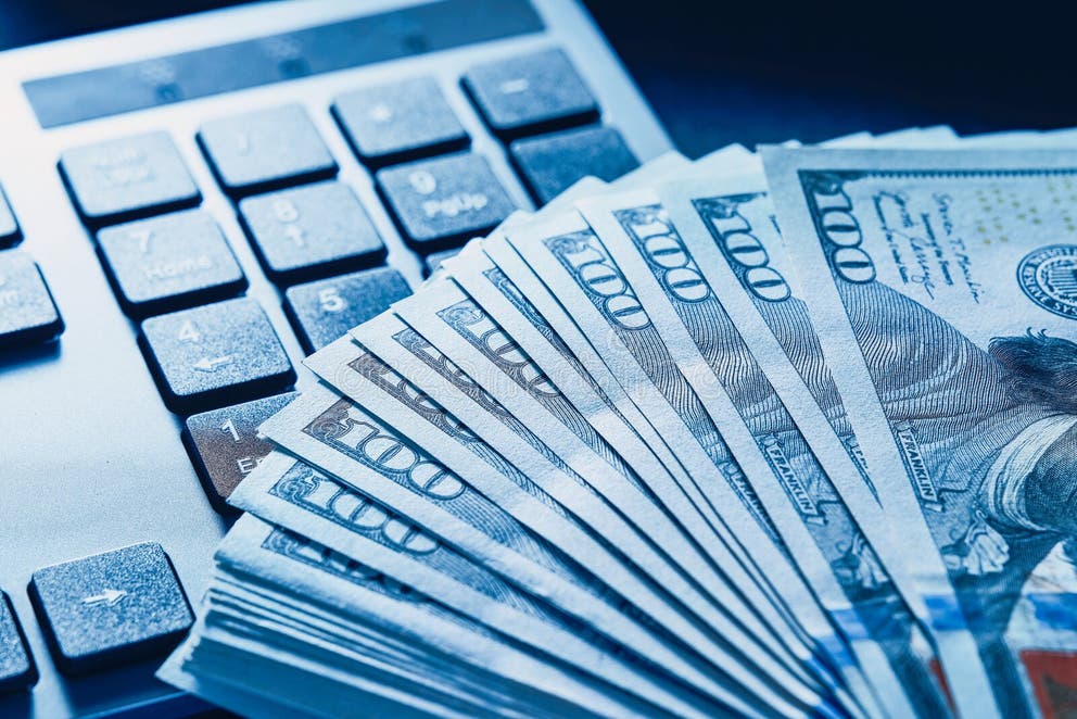 Close-up of One Hundred Dollar Banknotes and Computer Numeric Keypad ...