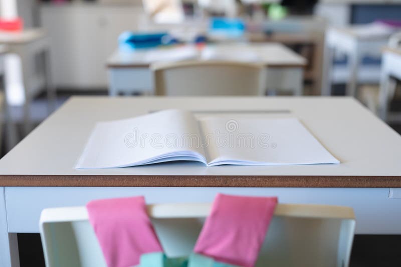 Close-up of Open Book on Desk in Classroom Stock Photo - Image of ...