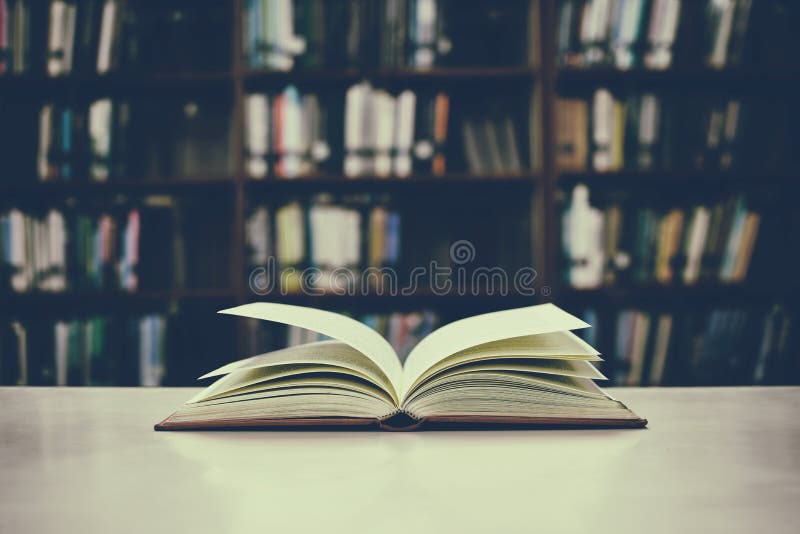 Close Up of Open Book on Desk with Vintage Filter Blur Background Stock ...