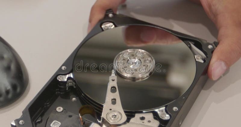Close-up of an Open Hard Disk Drive in the Hands of a Technician Stock ...