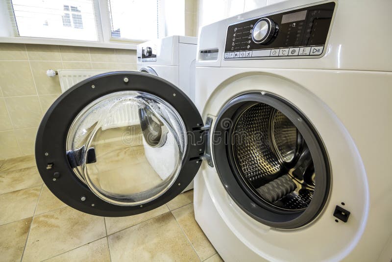 A Close Up of Open Washing Machine in Bathroom Stock Photo - Image of ...
