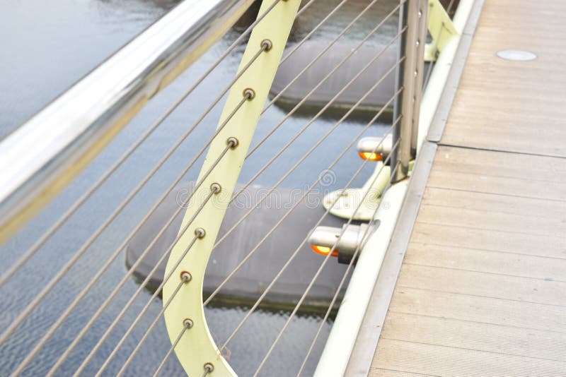 Close Up of Orange Lights on a Bridge Railing Stock Image - Image of ...