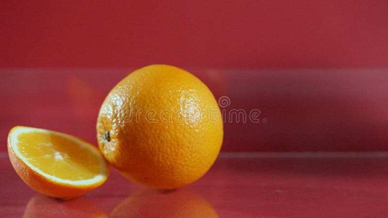 Close Up of Fresh Orange Movement Rolling and Stop at Sliced Orange ...