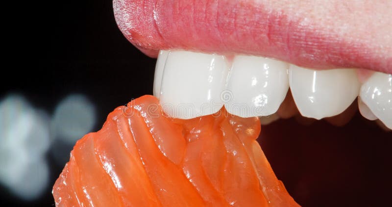 Close-up Orange in the Woman`s Mouth Stock Image - Image of studio ...