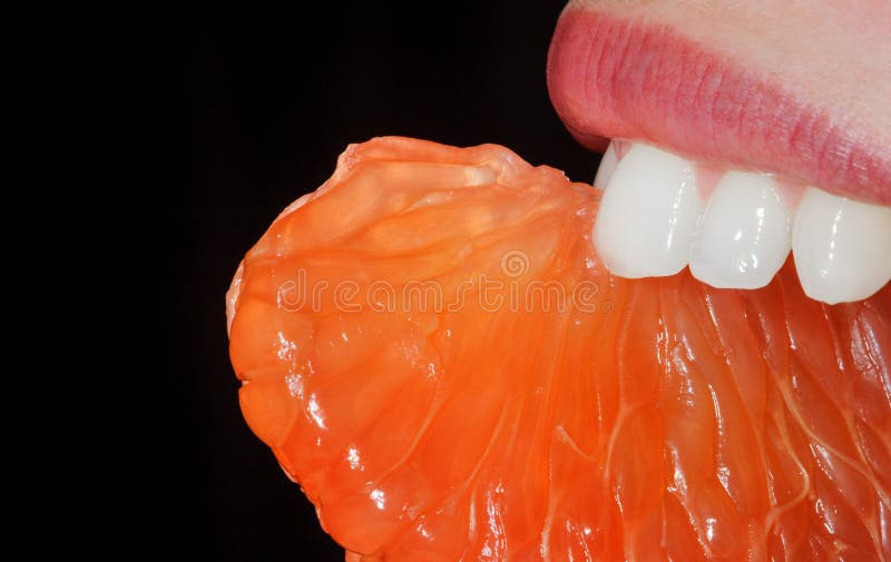 Close-up Orange in the Woman`s Mouth Stock Photo - Image of teeth ...