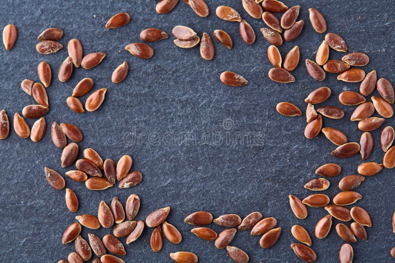 Close Up Organic Flax Seeds on Black Stone Plate Stock Photo - Image of ...