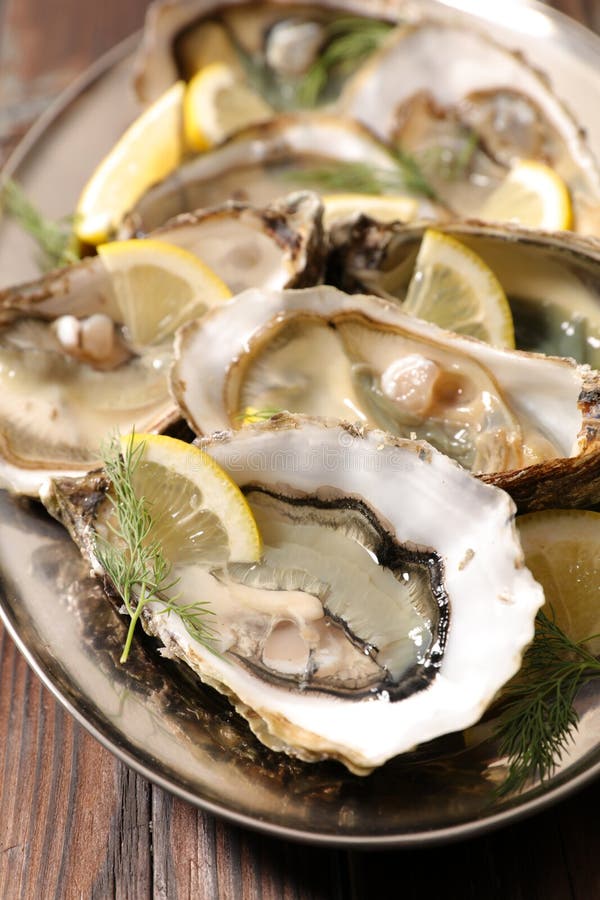 Oyster with lemon stock photo. Image of shell, appetizer - 104067936