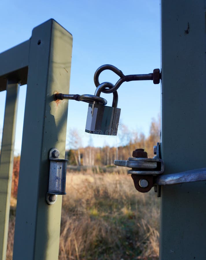 Close-up of Padlock on Gate during Day Stock Photo - Image of secrecy ...