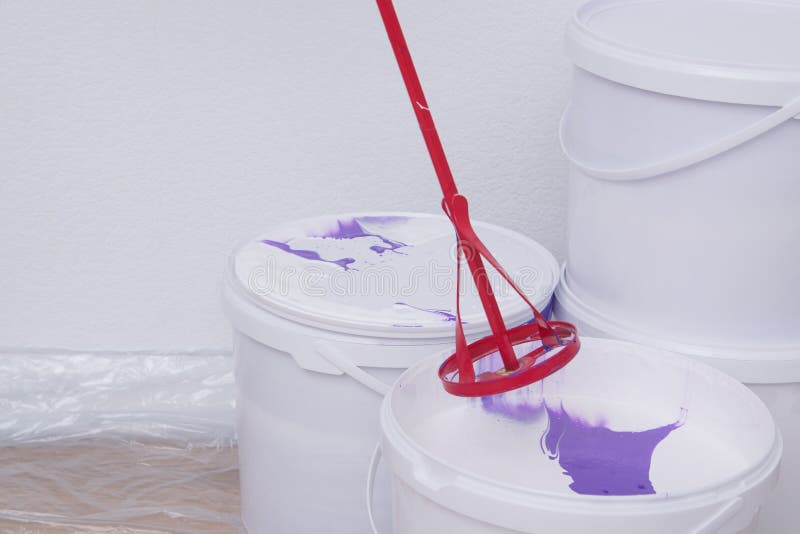 Close-up of Paint Buckets and a Stirrer, Against a White Wall Stock ...