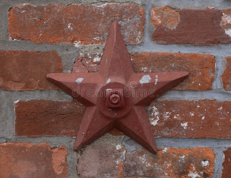 Close Up of a Painted Metal Star in a Brick Wall Stock Image - Image of ...