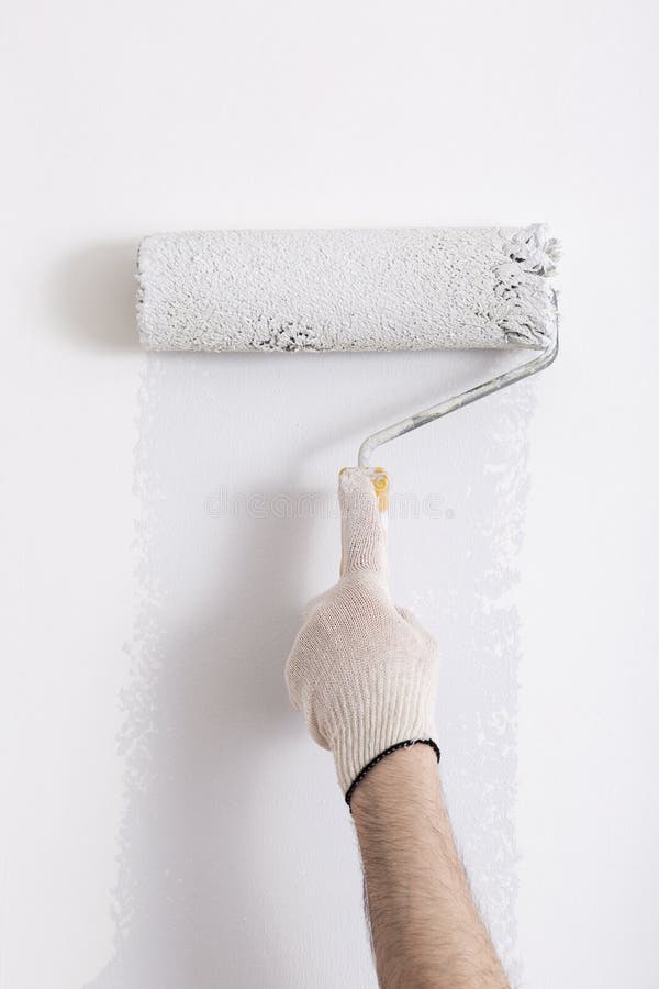 Close Up of Painter Arm Painting a Wall with Paint Roller Stock Photo ...