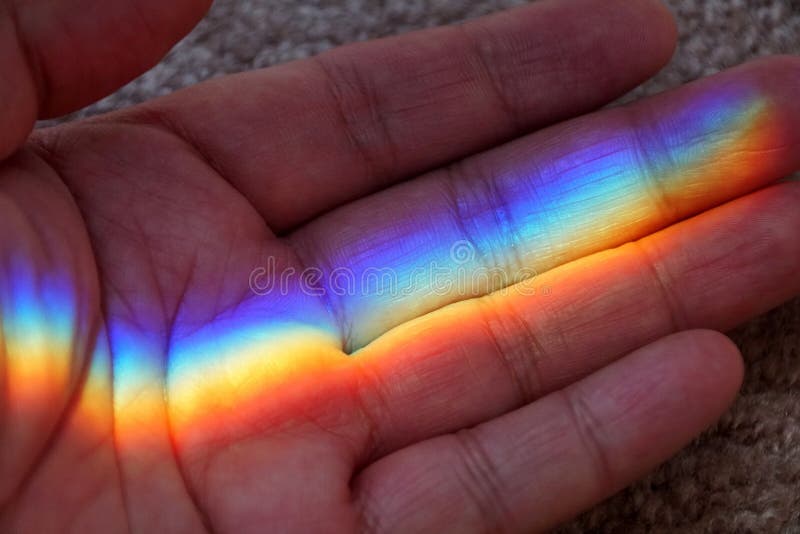 A Palm with Rainbow Reflection from a Glass Mirror Stock Image - Image ...