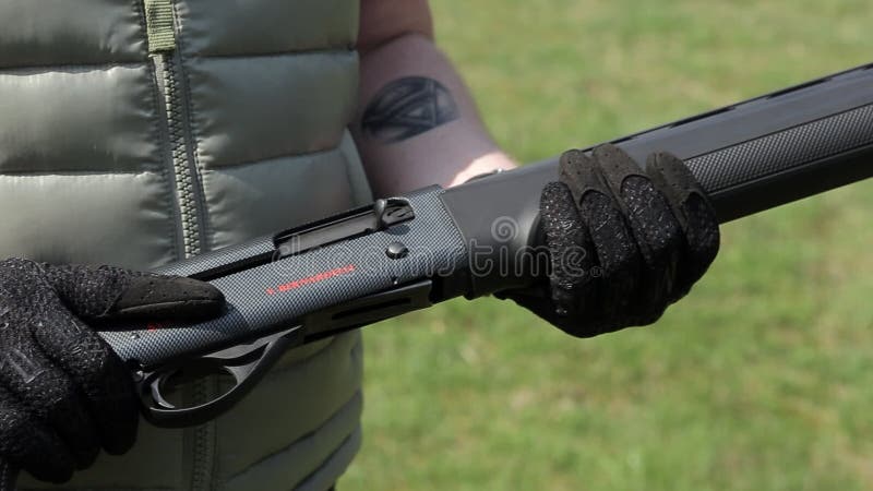 Shotgun in Man S Hand. Front Side of Weapon with Close Up View on ...