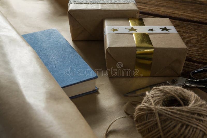 Close Up of Paper with Gift Box by Scissor and Thread Spool Stock Image ...