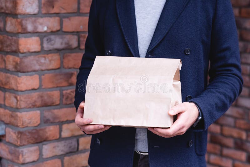 Close-up Paper Package for Delivery in Male Hands. Express Delivery ...