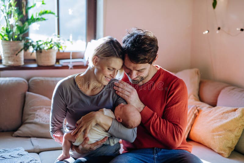 Close-up of Parents Cuddling Their Newborn Baby. Stock Image - Image of ... Close-up of Parents Cuddling Their Newborn Baby. Stock Image - Image of ...