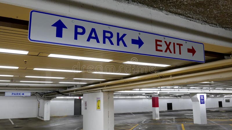 Close Up Park and Exit Sign Stock Video - Video of garage, asphalt ...