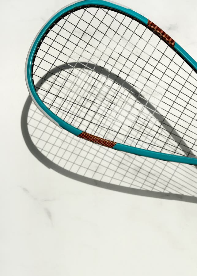 Close-up of Part of a Racket Brightly Lit by the Sun, Casting a Hard ...