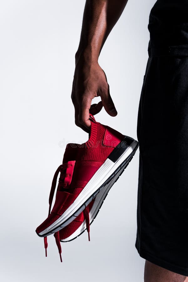 Close-up Partial View of African American Sportsman Holding Sports ... Close-up Partial View of African American Sportsman Holding Sports ...