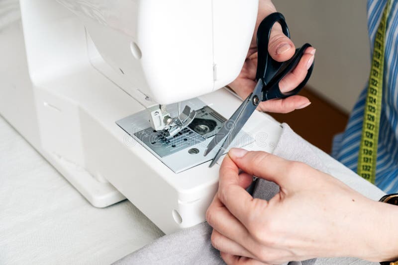 Close-up Partial View of Seamstress Working with Sewing Machine at ...
