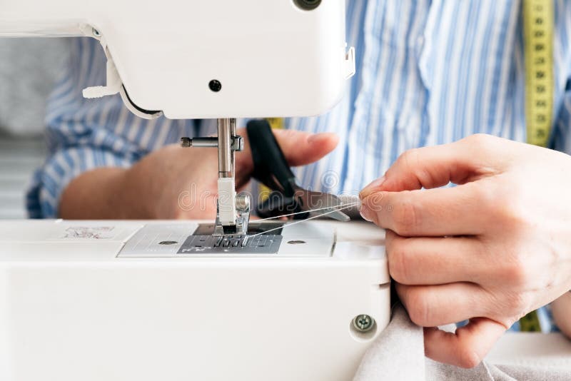 Close-up Partial View of Seamstress Working with Sewing Machine at ...
