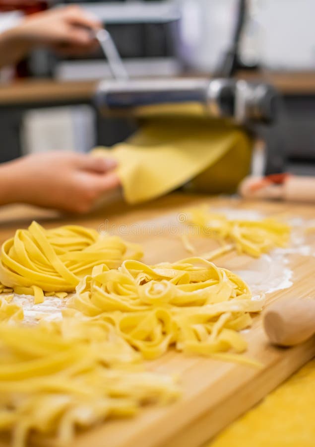 Close Up of Pasta and Hands Making Home Made Italian Pasta Stock Photo ...