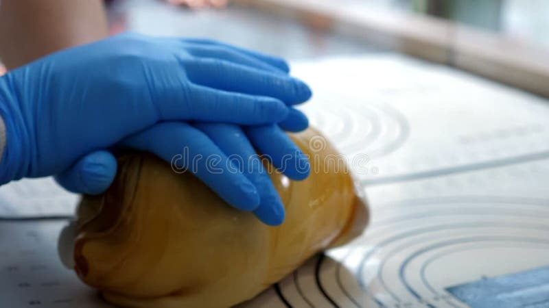 A Close-up of a Pastry Chef Mixing Soft Caramel on a Table in a Pastry ...