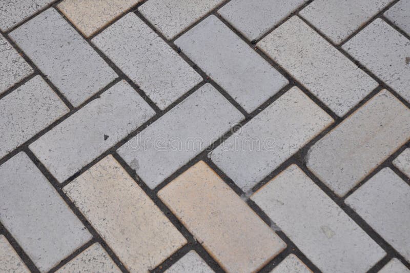 A Close Up of a Paving Herringbone Pattern Background As a Common Paver ...