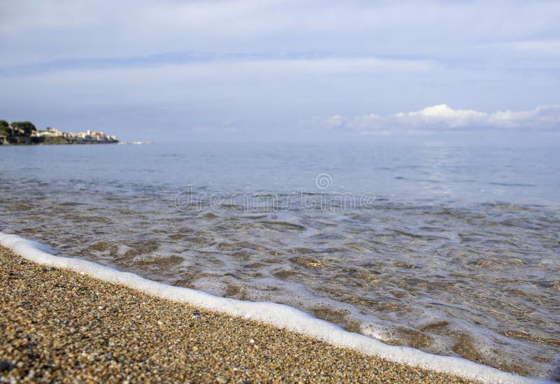 Close-up of Pebble Beach with Light Reflecting on Stones. Pebble Beach ...