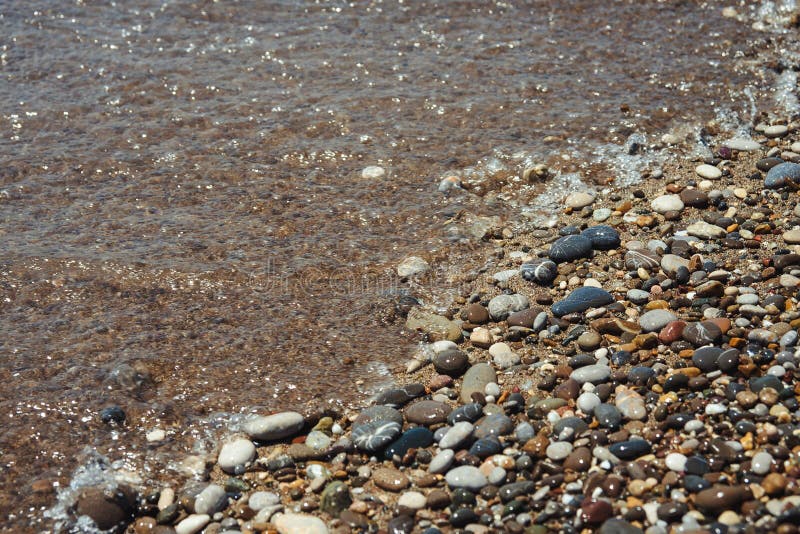 Close Up of a Pebble Beach with the Sea. Stock Image - Image of clear ...