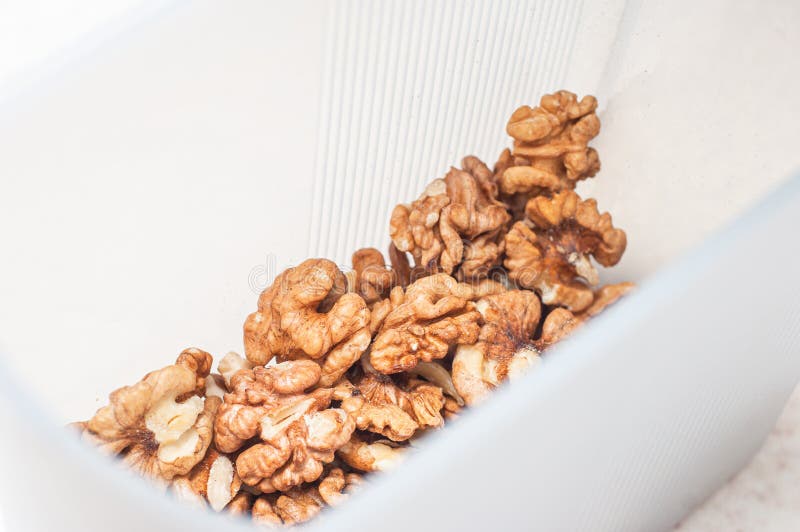 Close-up Peeled Walnut Kernels in a Plastic Storage Container Stock ...