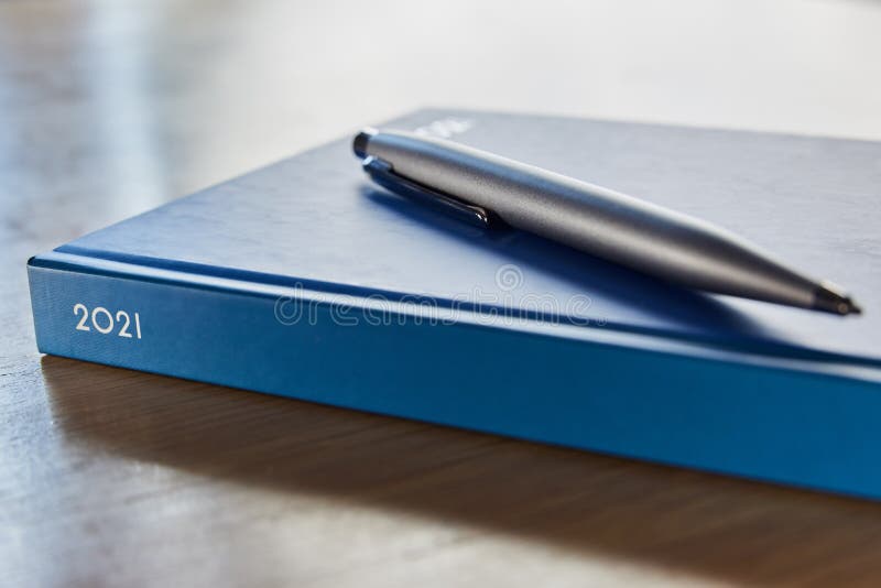 Close Up of Pen Resting on 2021 Desk Diary on Table Stock Image - Image ...