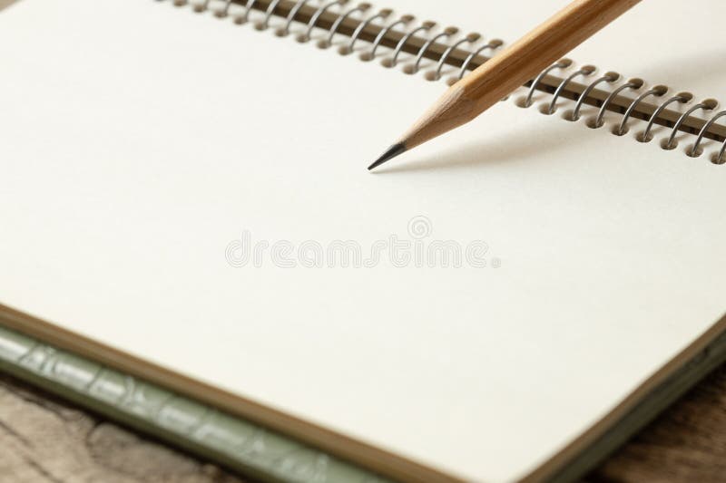 Close-up of a Pencil Writing in an Open Notebook, Notes and Memos Stock ...