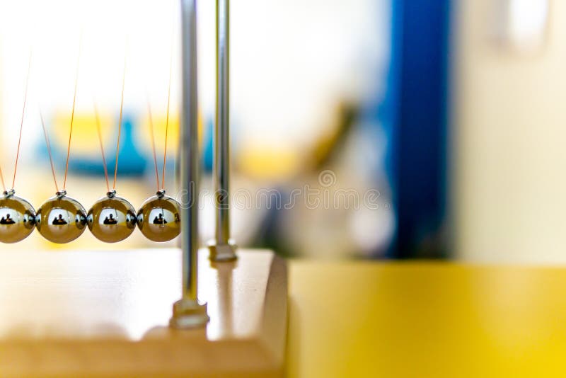 Close Up of a Pendulum with a Blurred Background Stock Image - Image of ...