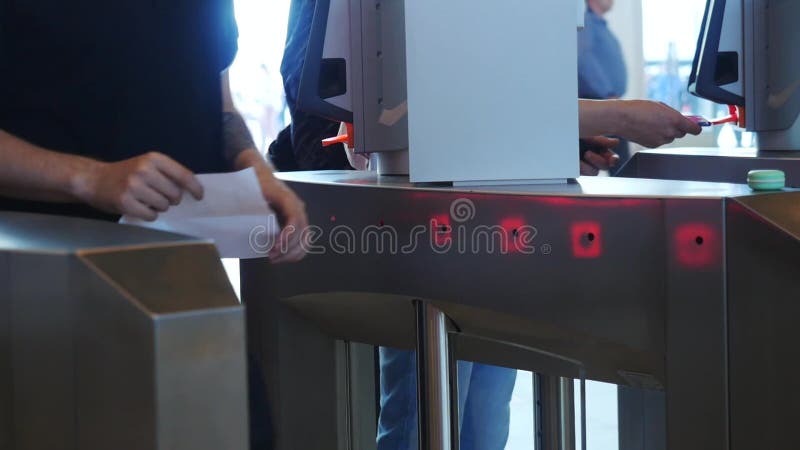 Close-up of People Passing Electronic Turnstile with Barcode Scanner ...