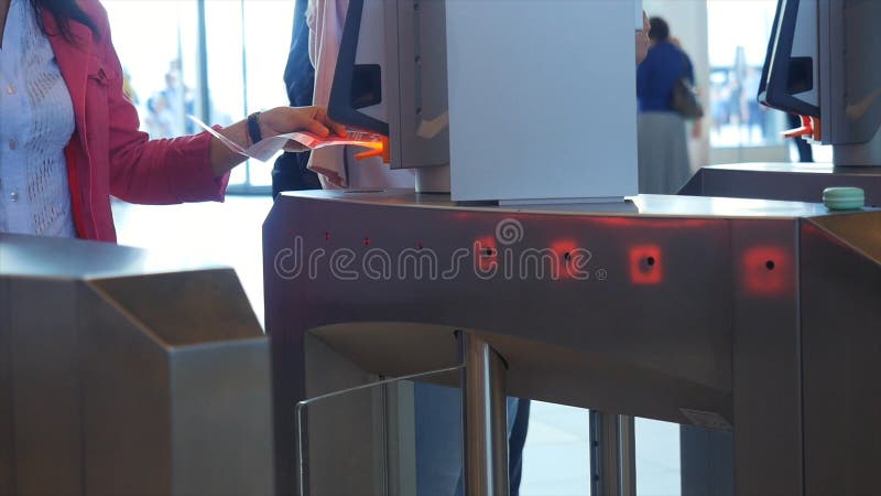 Close-up of People Passing Electronic Turnstile with Barcode Scanner ...