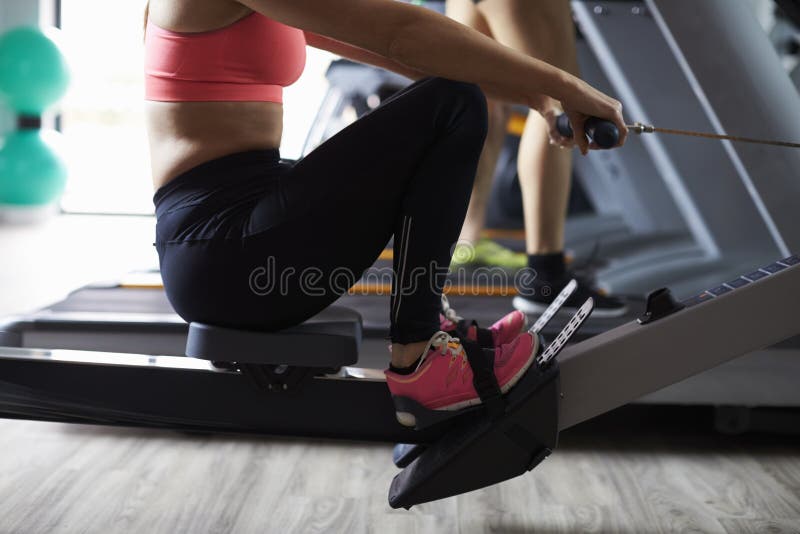 Close Up of People Using Equipment in Busy Gym Stock Photo - Image of ...