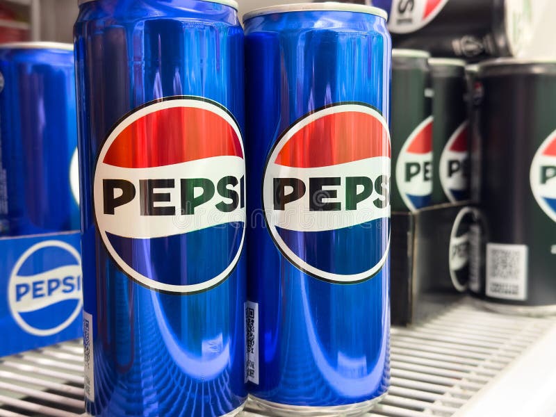 Close-up of Pepsi Cans on Store Shelf with Reflections and Branding ...