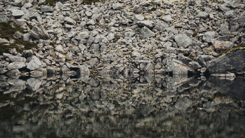 Close-up of a Perfect Reflection of Stones in Smooth Water, for ...