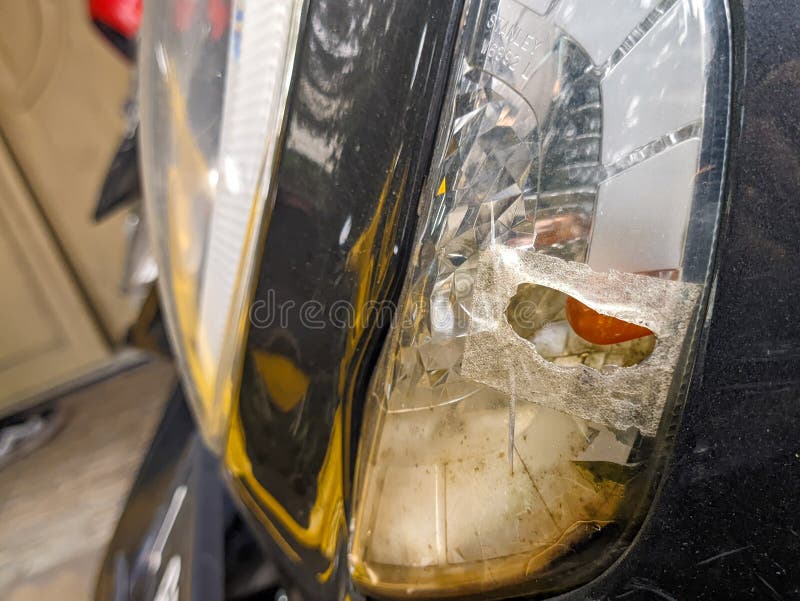 A Close Up of Perforated, Damaged or Broken Motorcycle Headlight Glass ...