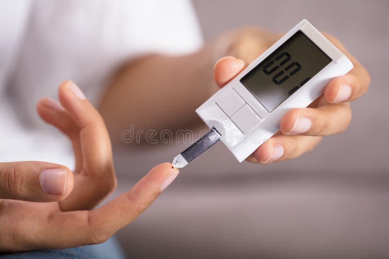 Person Checking Blood Sugar Level with Glucometer Stock Photo - Image ...