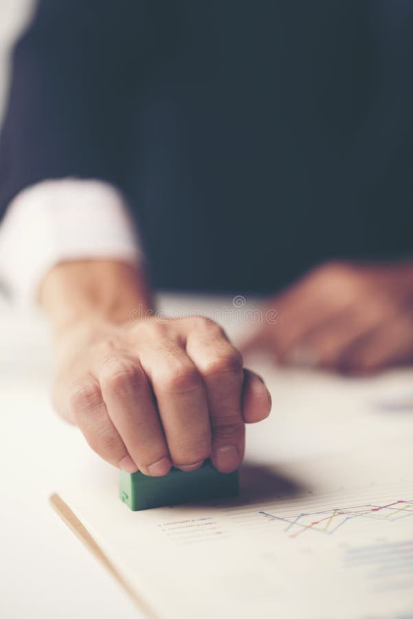 Close-up of a Person S Hand Stamping with Approved Stamp on Docu Stock ...