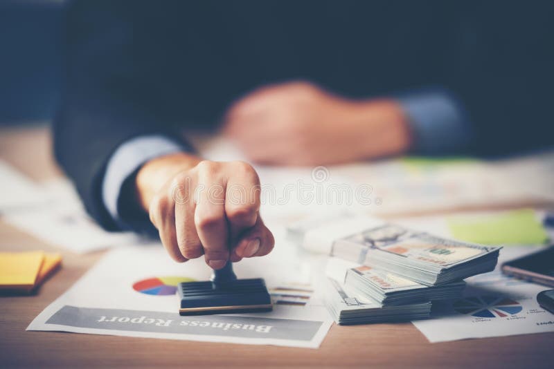 Person`s Hand Stamping with Approved Stamp on Document at Desk Stock ...