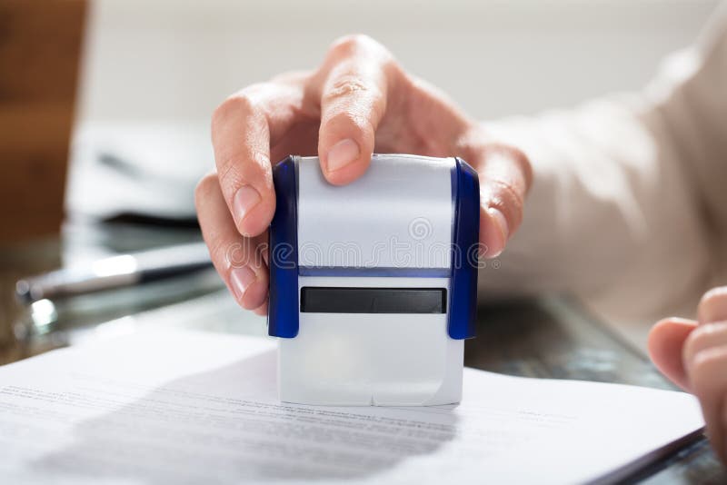 Close-up of a Person Stamping on Document Stock Photo - Image of ...