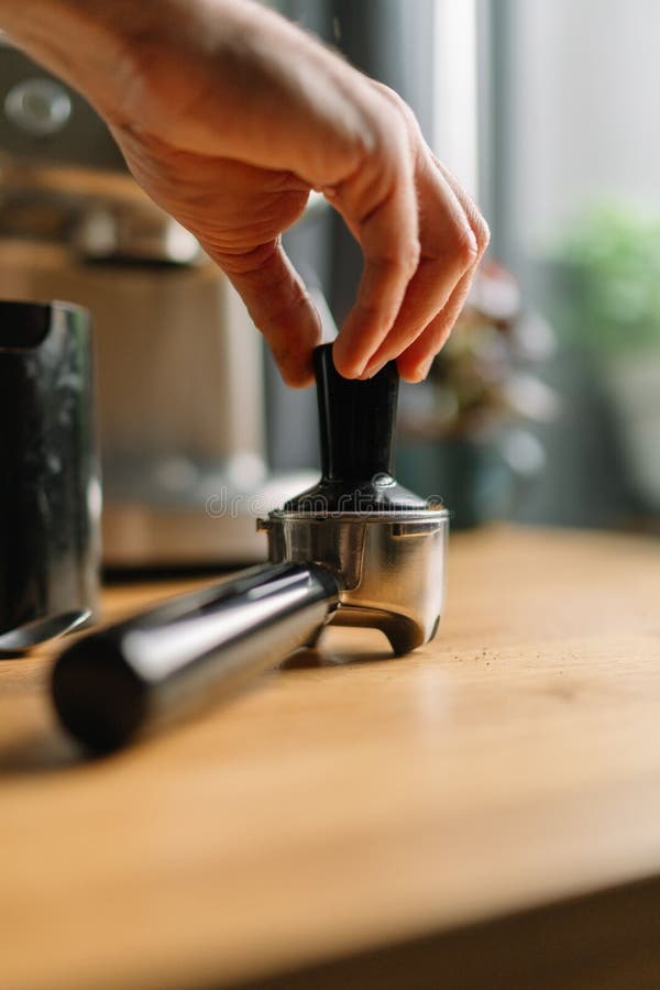 Close-up of a Person Using a Espresso Machine To Prepare a Coffee in a ...