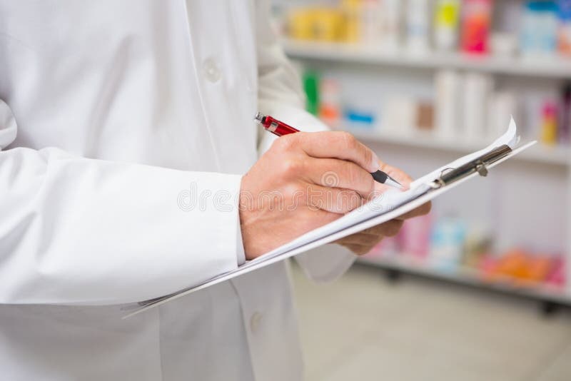 Close Up of Pharmacist Writing on Clipboard Stock Photo - Image of ...